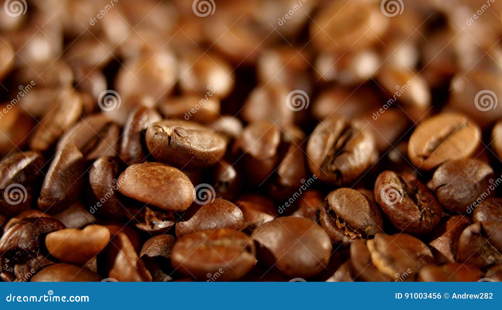 A Pile of Roasted Coffee Beans Rotating. Close Up Stock Photo - Image ...