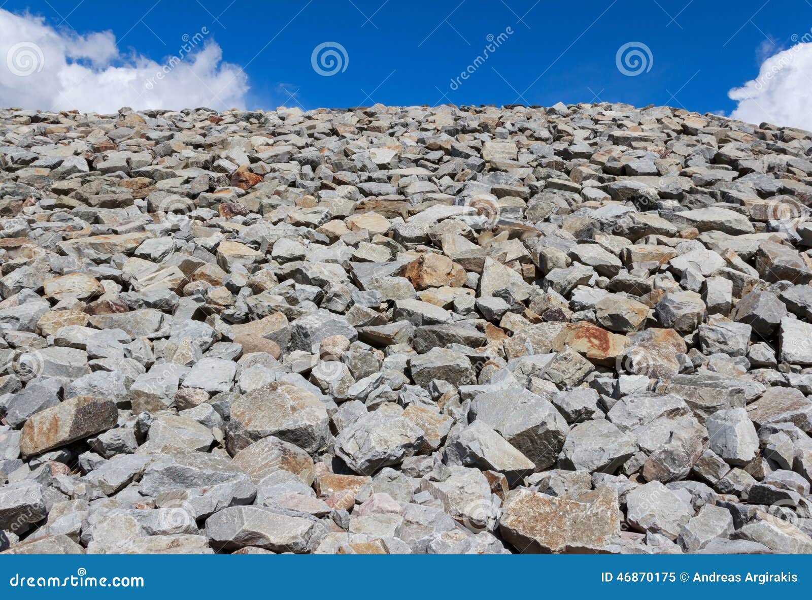 Pile of Rocks Against a Blue Sky Stock Image - Image of pile, clouds ...