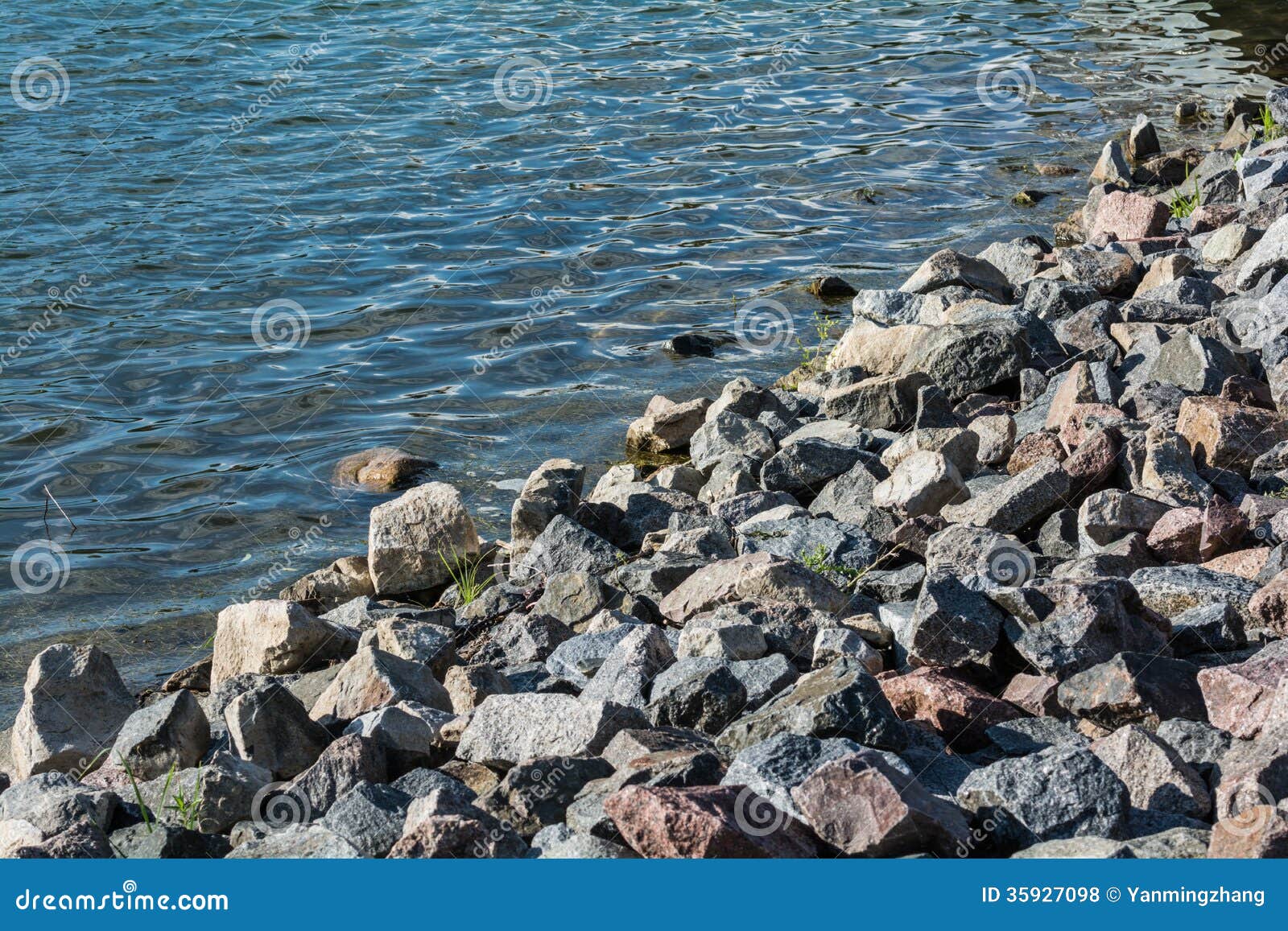Pile of rocks on lakeside stock photo. Image of bunch - 35927098