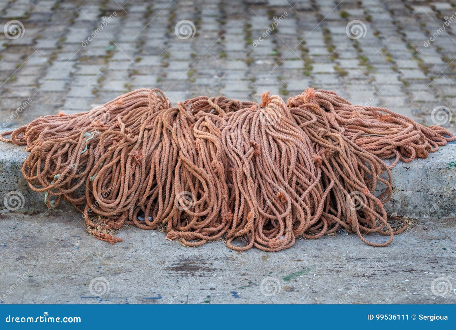 Pile of Rope on Asphalt for Fishermen`s Networks. Stock Image - Image ...