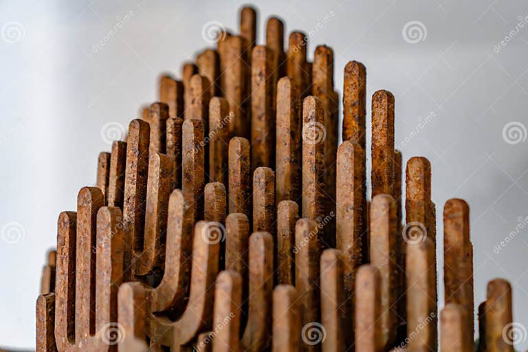 A Pile of Rusty Metal Sticks with a Triangular Shape Stock Photo ...