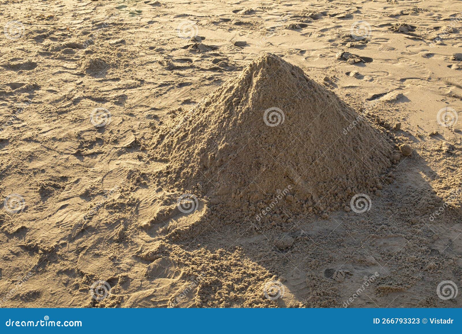 Pile of sand on the beach stock image. Image of footprints - 266793323