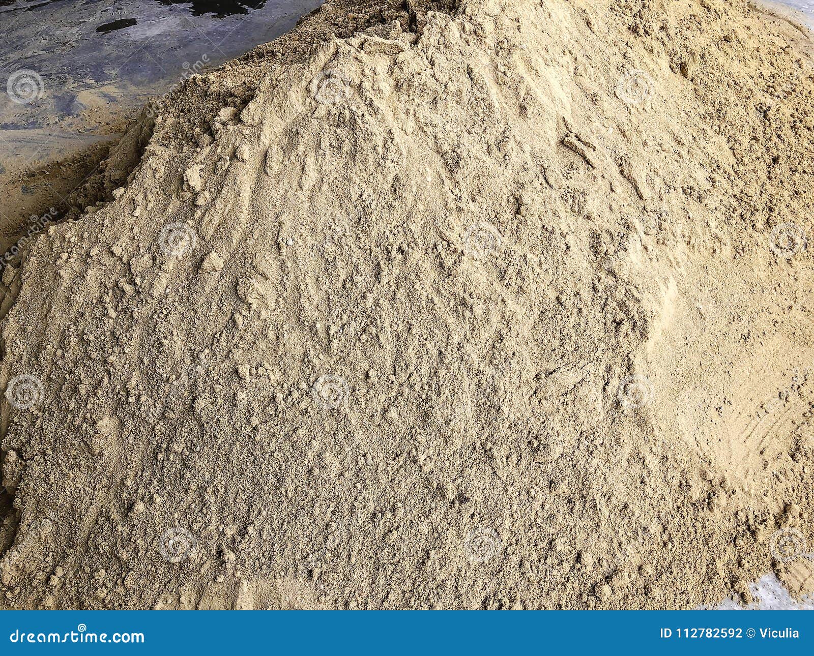 A Pile of Sand at a Construction Site. Construction Materials. Stock ...