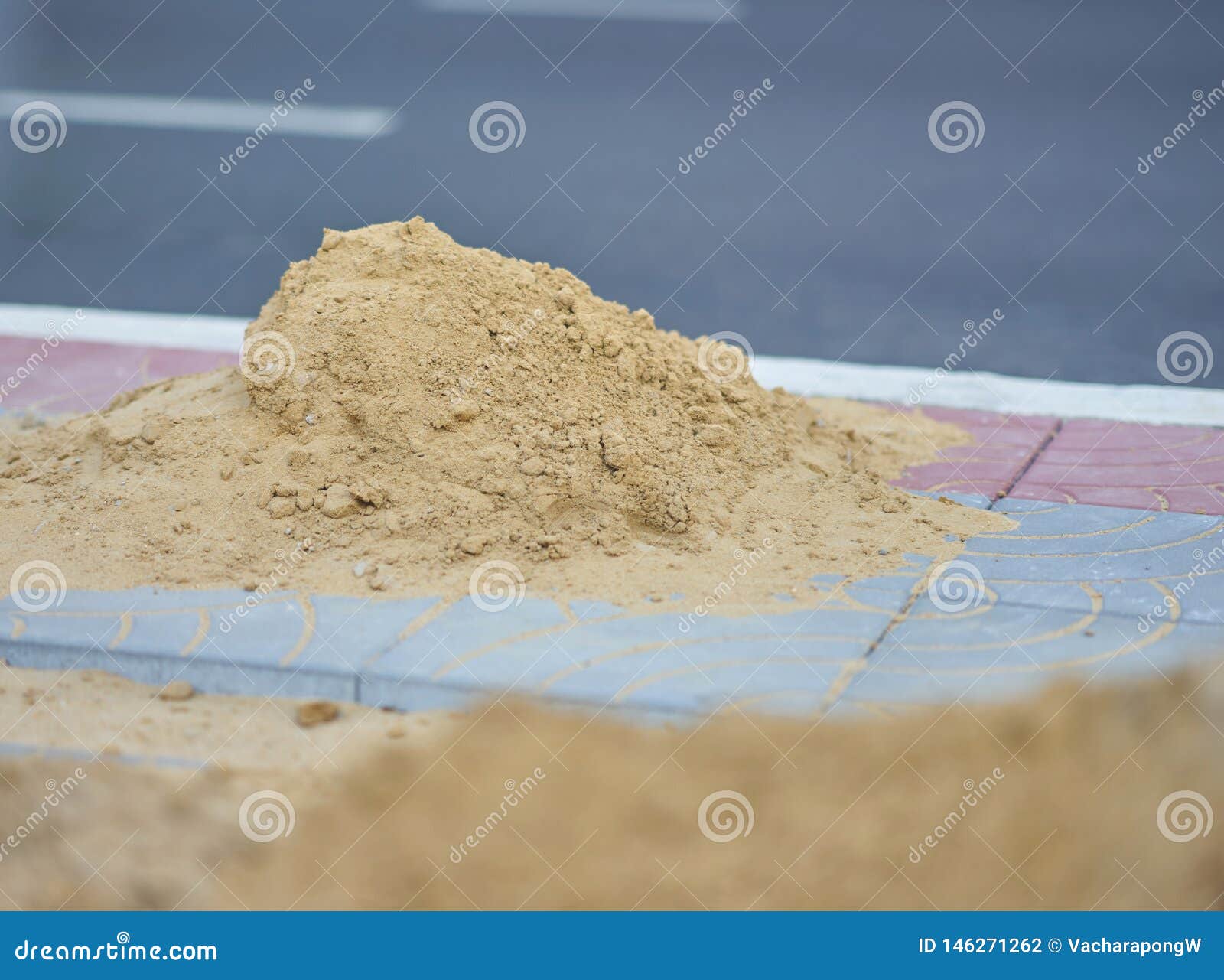 Pile of sand on footpath stock photo. Image of building - 146271262