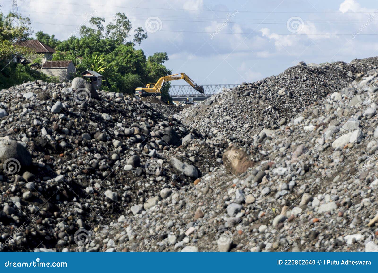 Pile of Sand and Rocks in Construction Area and Excavator Stock Photo ...