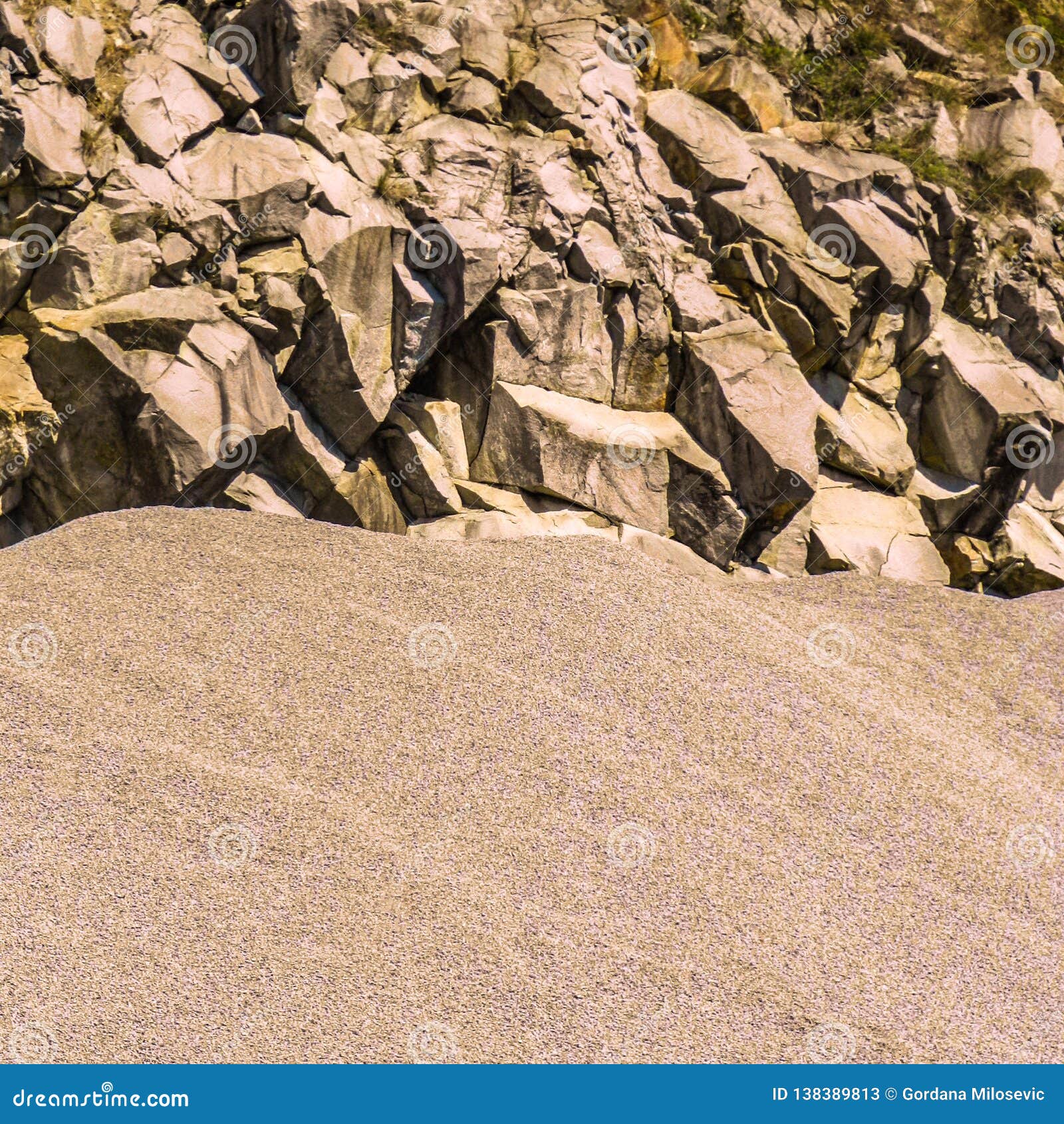 Sharp Broken Rock in the Background and a Smooth Texture of Sand in ...