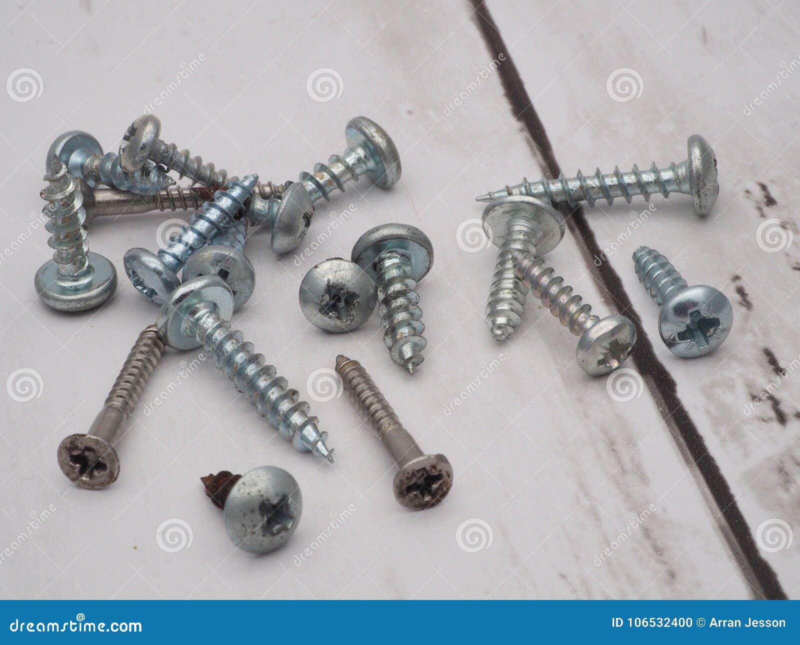 Pile of scattered screws stock photo. Image of messy - 106532400