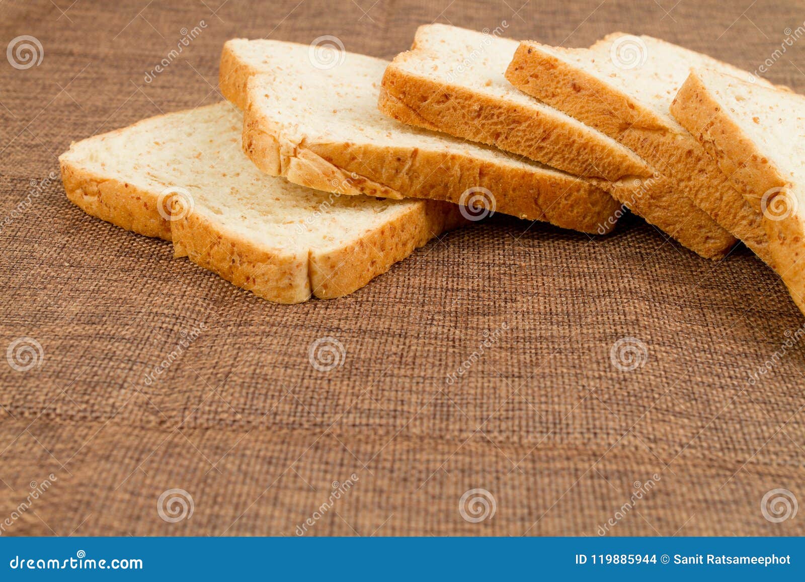 Pile Slice of Whole Wheat Bread on Dark Brown Calico. Stock Photo ...