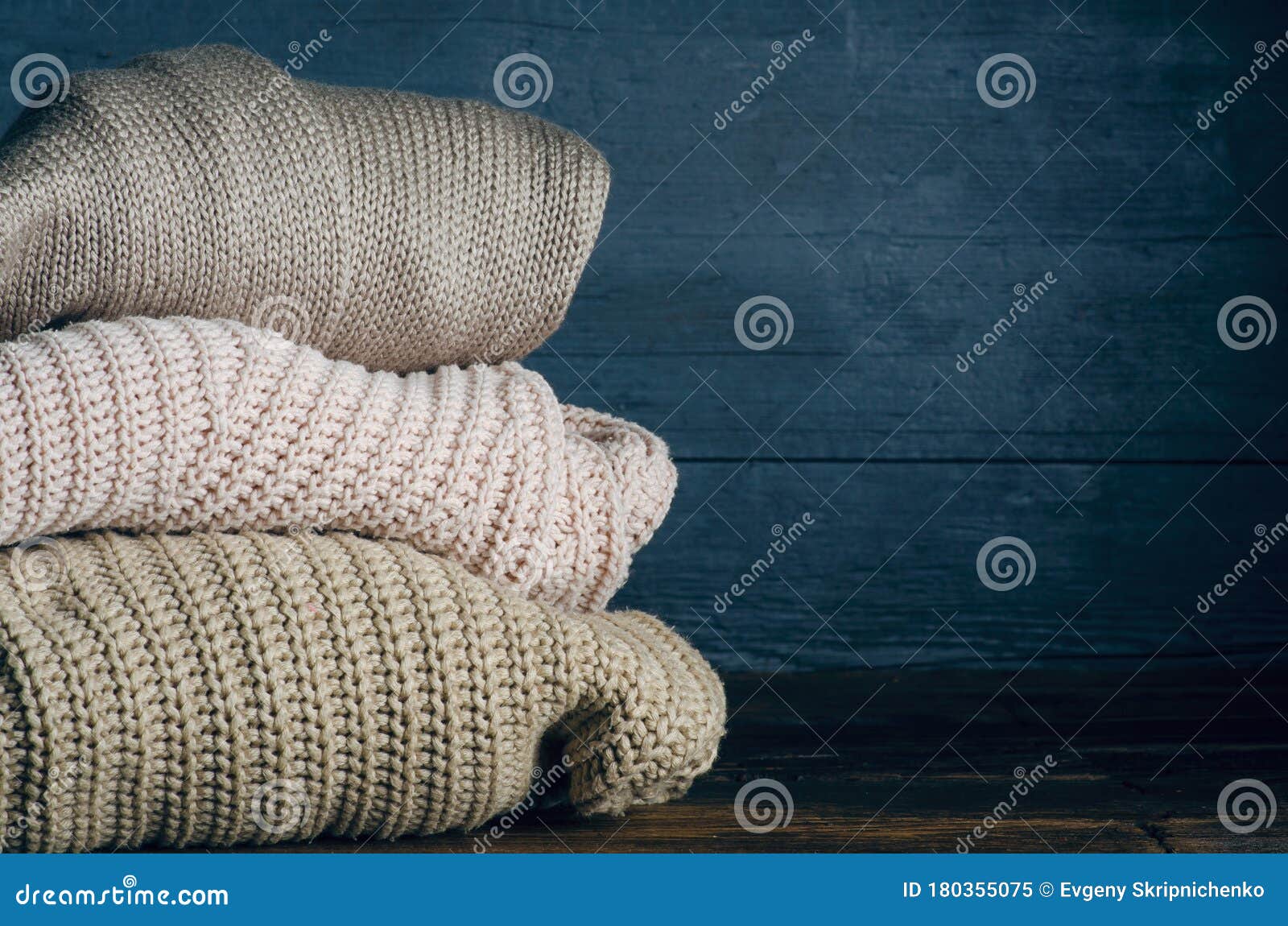 Pile Stack Folded of Knitted Warm Clothes on Wooden Background ...