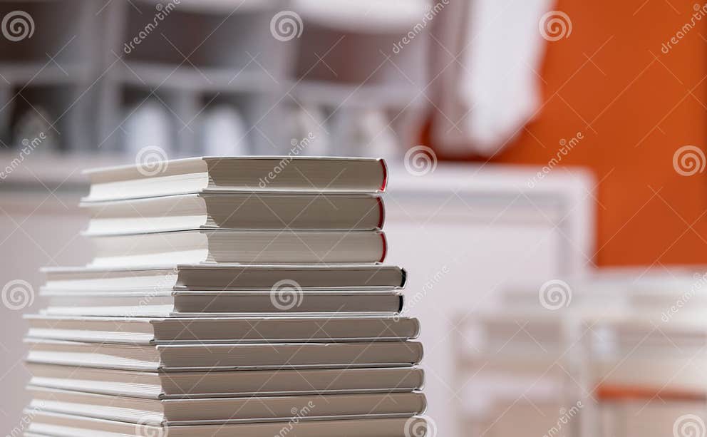 Pile Stack of White Books on Table in Modern Interior. Study or ...