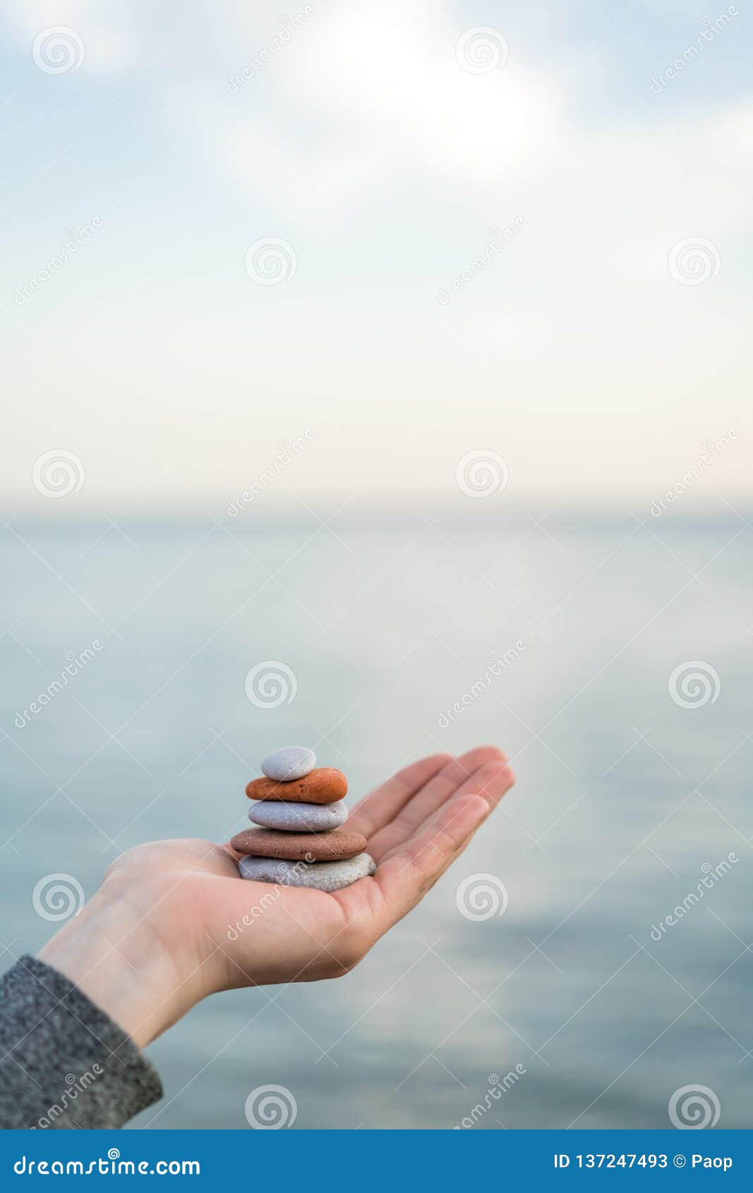 Pile of Stacked Stones in Human Hand Stock Image - Image of coast ...