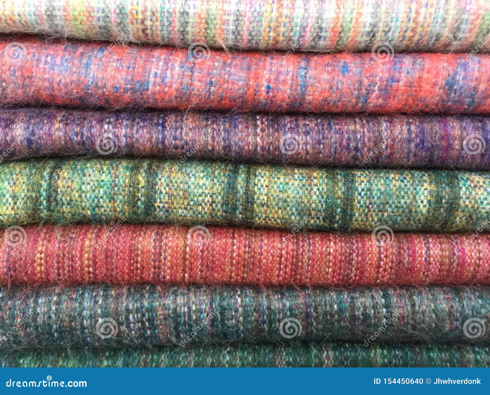 A Pile of Thick Woolen Robes in Several Colors Made by Hand Stock Photo ...