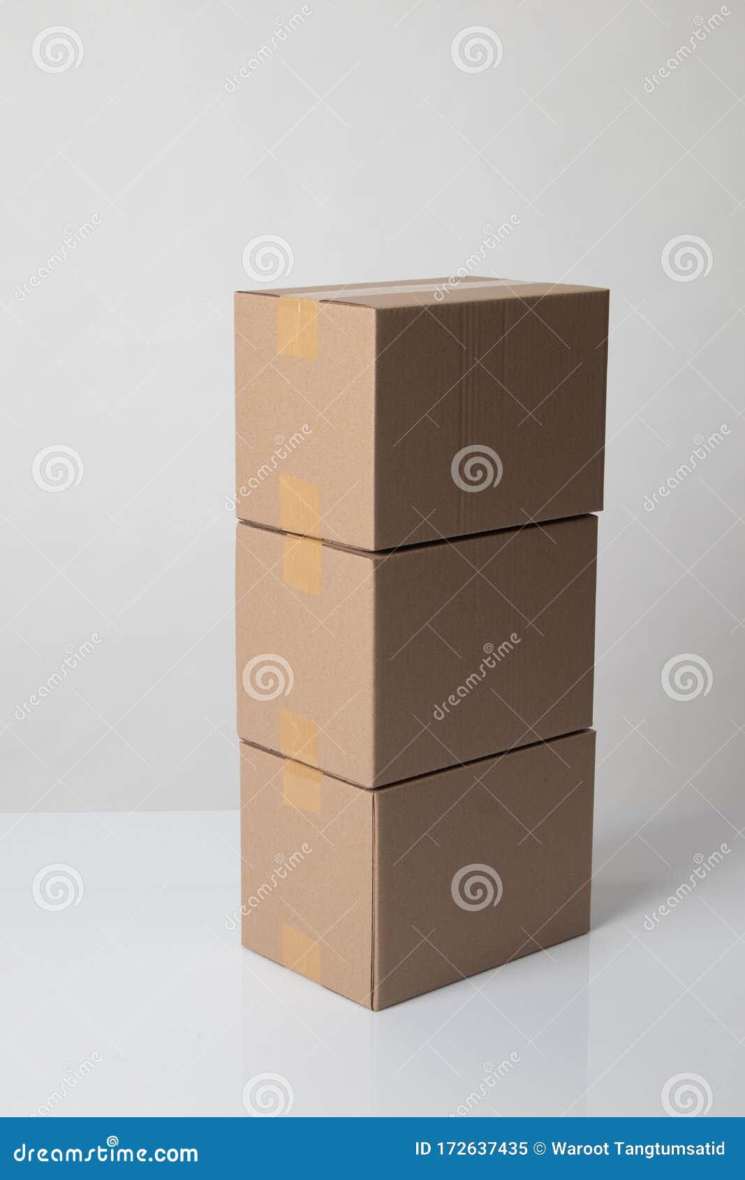 Pile of Three Taped Up Cardboard Boxes Stock Image - Image of ...