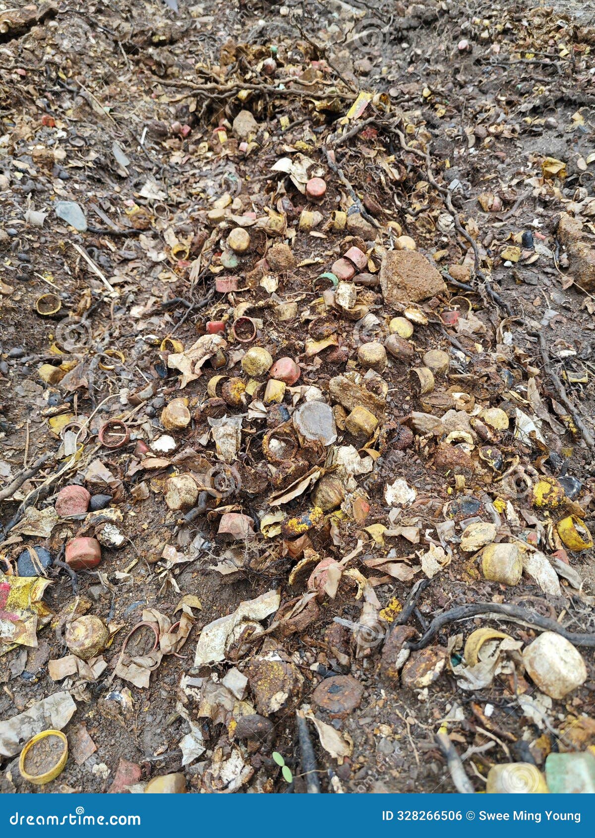 Pile of Thrown Way Rusted and Decayed Bottle Caps on the Muddy Ground ...