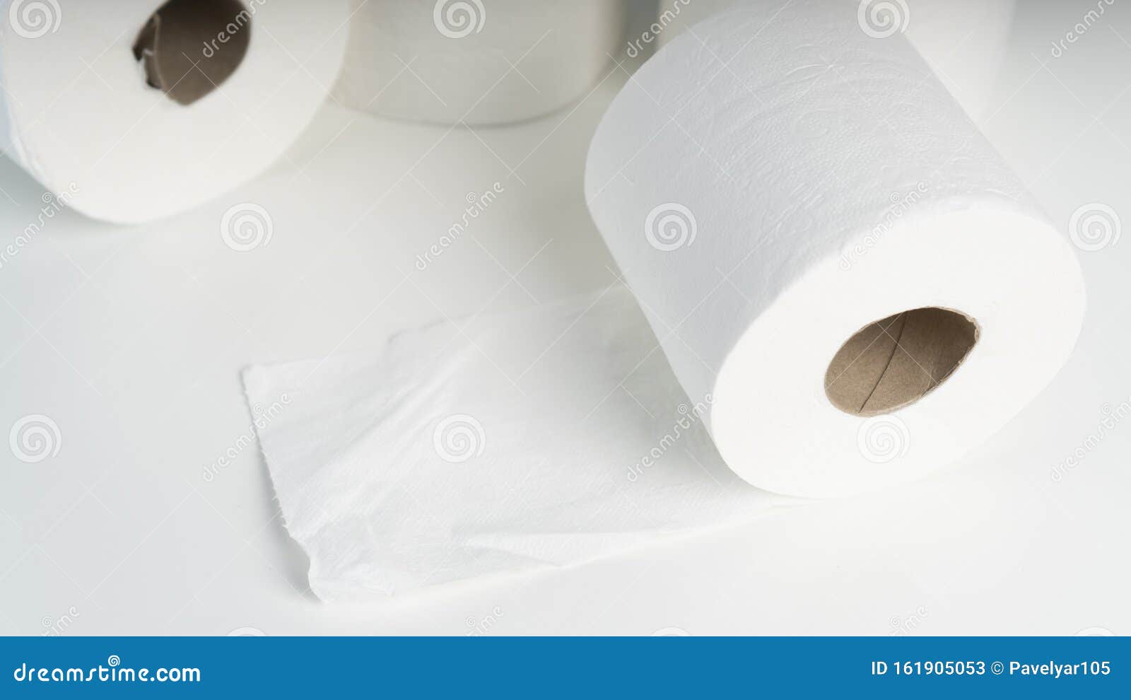 A Pile of Toilet Paper Rolls on a White Table Stock Image - Image of ...