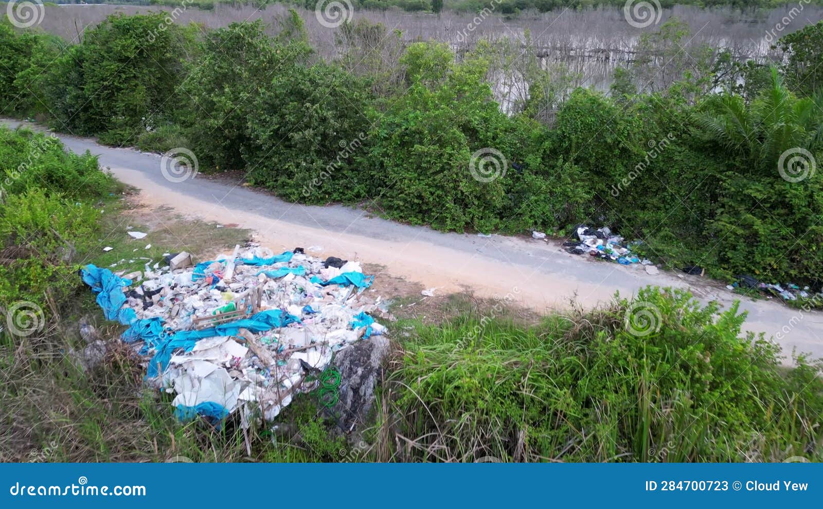A Pile of Trash Sitting on the Side of a Road Stock Video - Video of ...