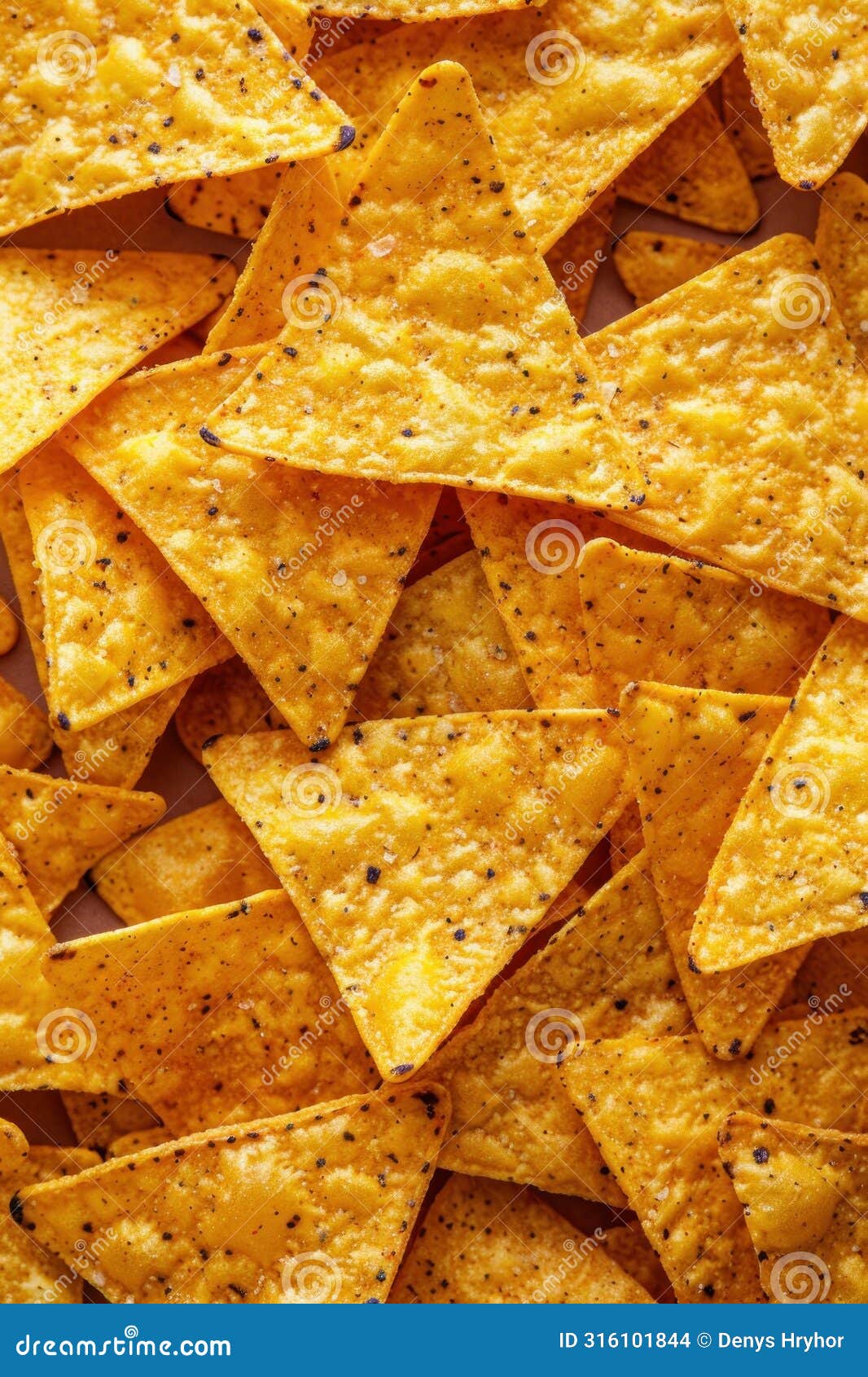 A Pile of Triangular Yellow Tortilla Chips Neatly Stacked on Top of a ...