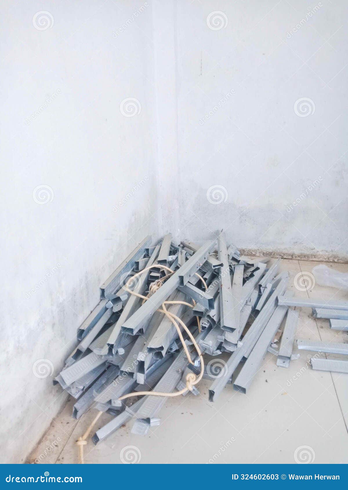 A Pile of Unused Pieces of Light Iron on the Edge of the Wall Stock ...