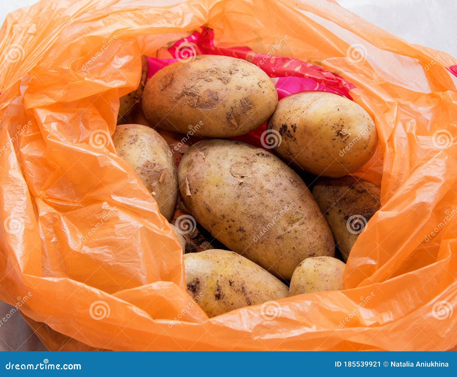 A Pile of Unwashed Potatoes Lies in a Bag Stock Image - Image of ...