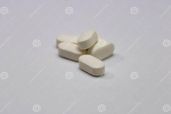 Pile of white tablets stock photo. Image of medical - 211301364