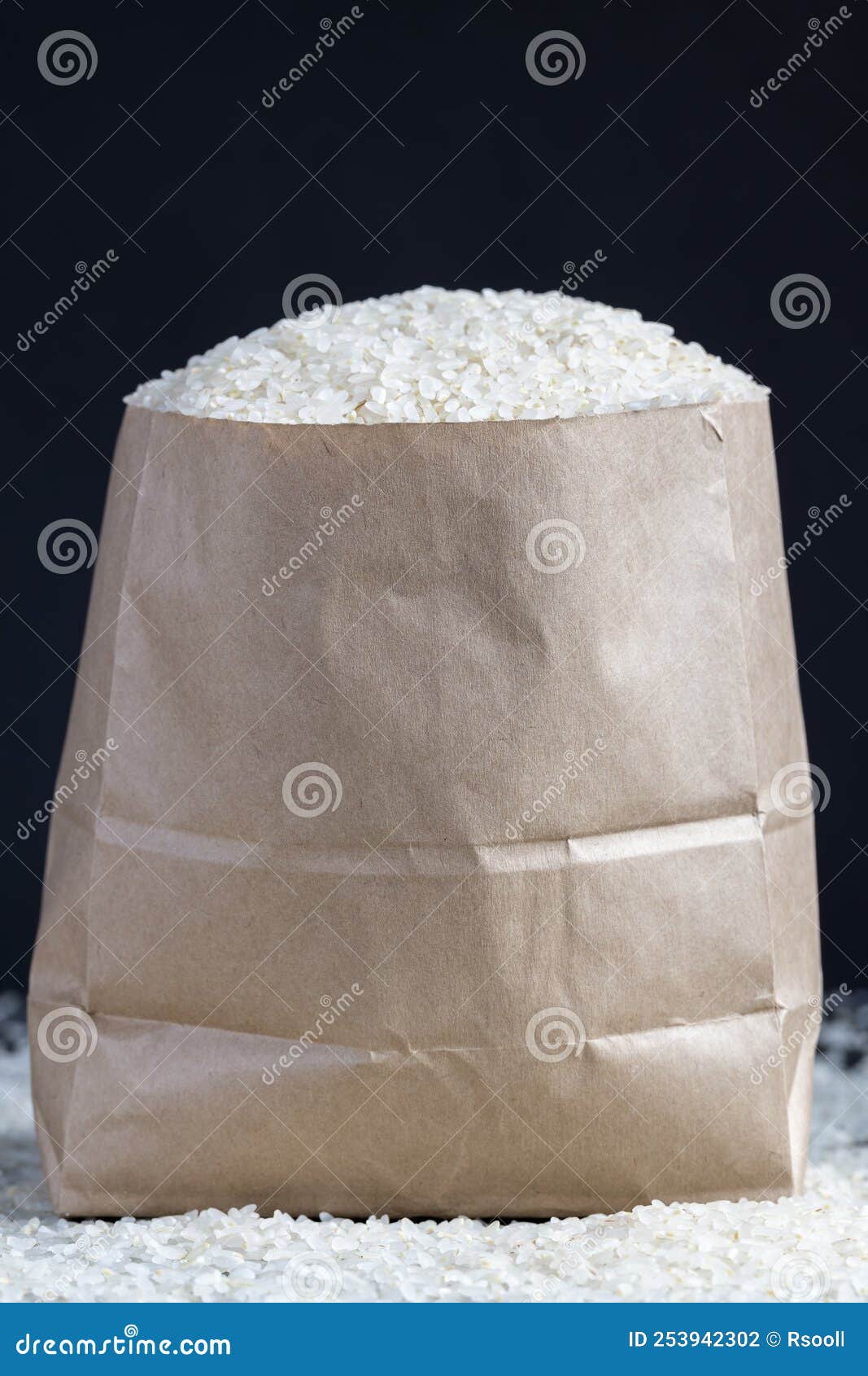 A Pile of White Rice in a Paper Bag and on the Table Stock Photo ...