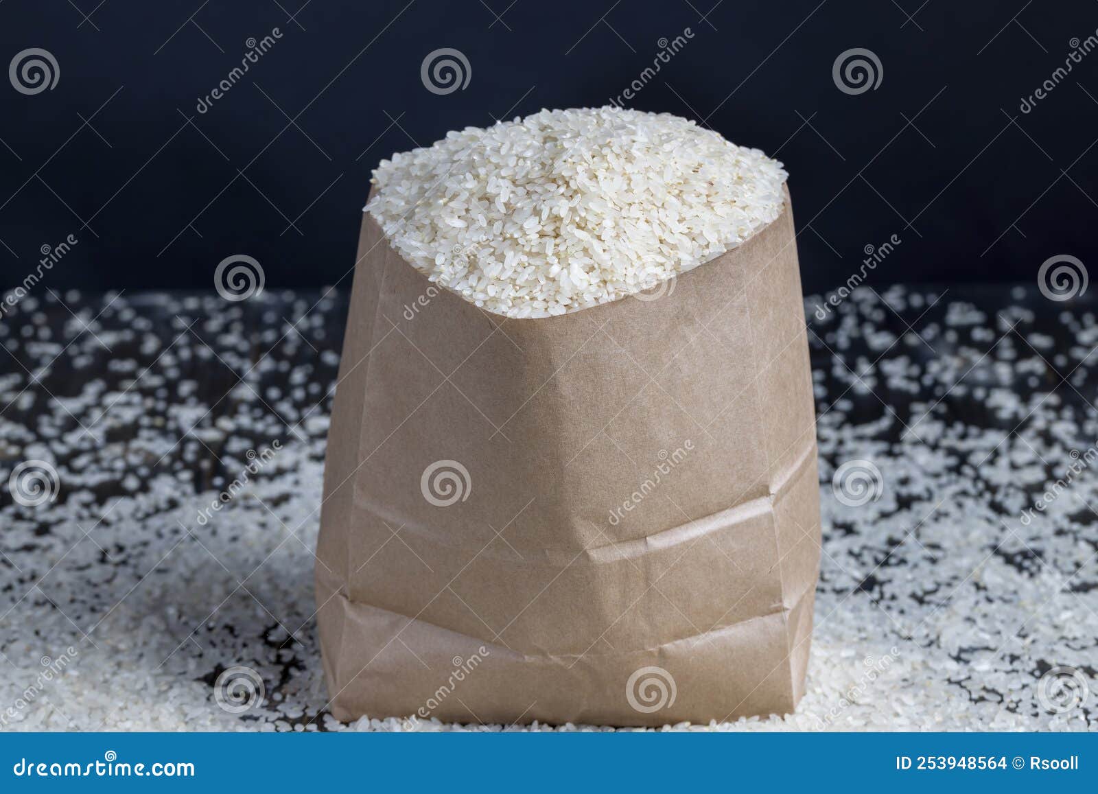 A Pile of White Rice in a Paper Bag and on the Table Stock Photo ...