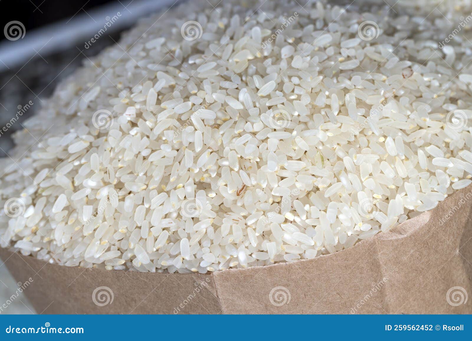 A Pile of White Rice in a Paper Bag and on the Table Stock Photo ...