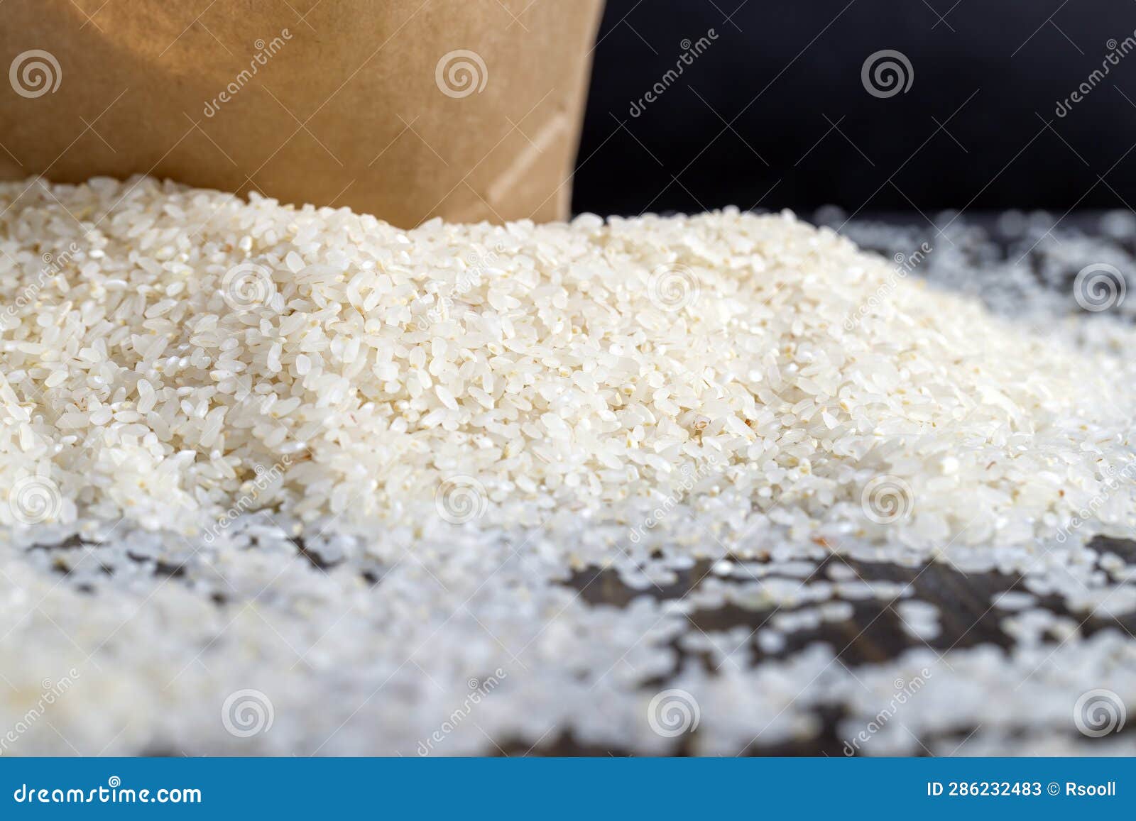 A Pile of White Rice in a Paper Bag and on the Table Stock Image ...