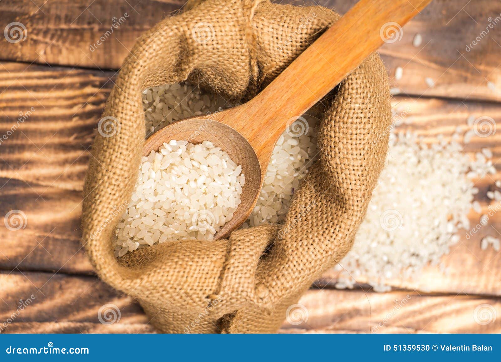 A Pile of White Rice Sitting on a Brown Burlap Stock Photo - Image of ...