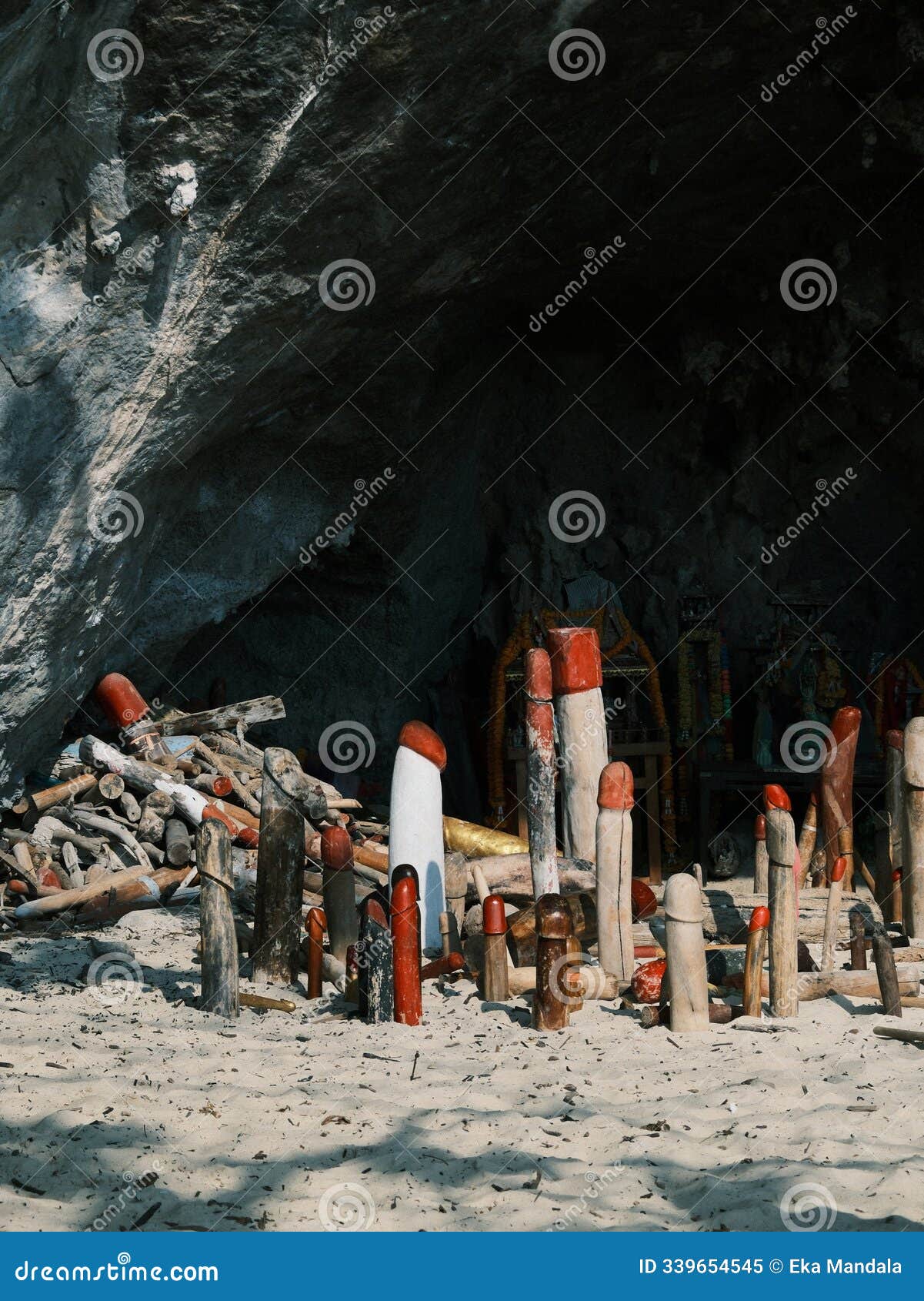 A Pile of Wood and Red and White Objects in a Cave Stock Image - Image ...