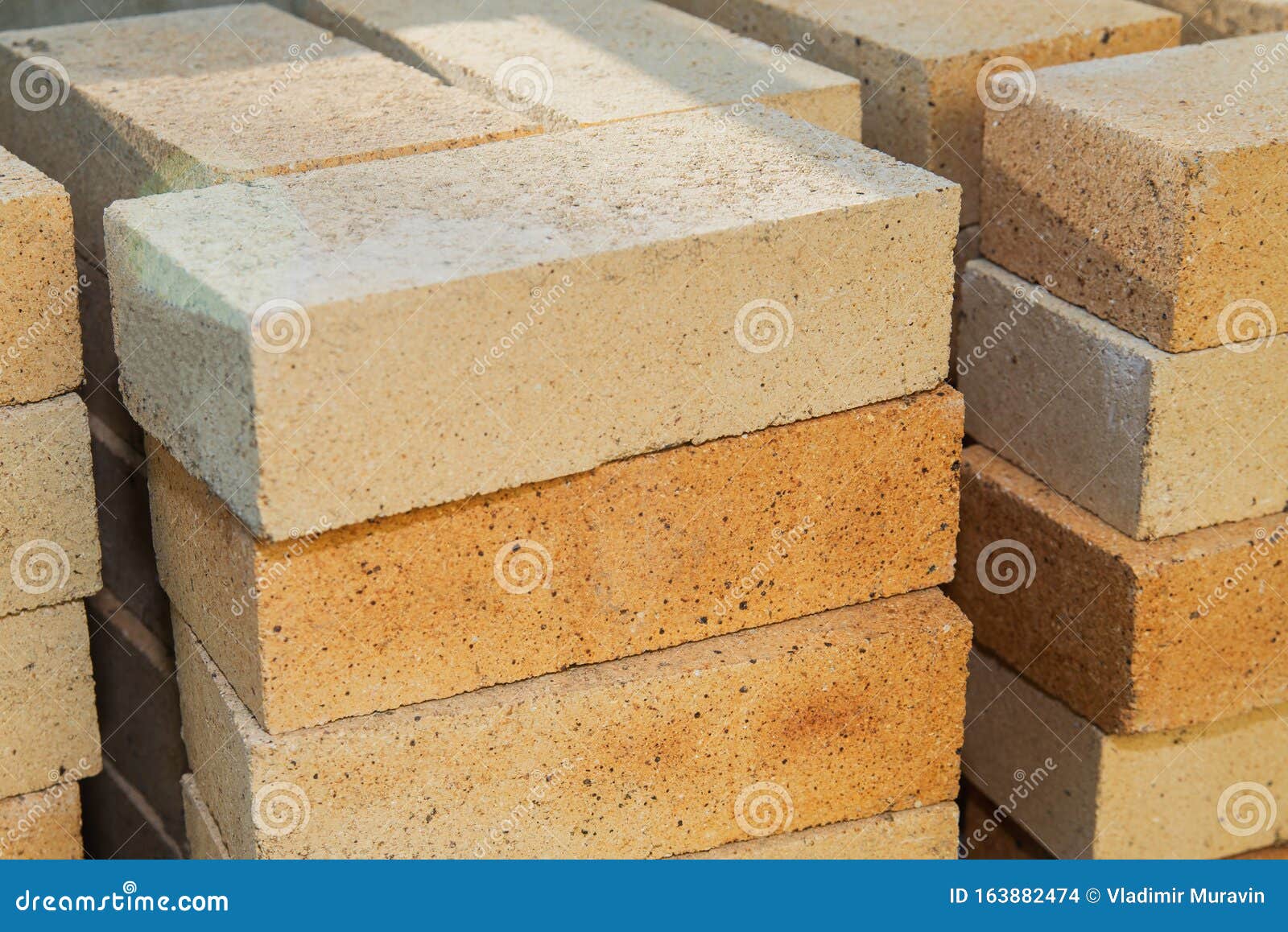 Pile of yellow sand bricks stock photo. Image of blank - 163882474