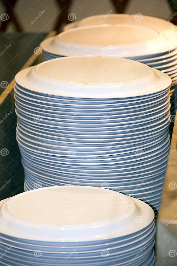 Piled Stack of Clean Dishes Plates Stock Photo - Image of side, gray ...