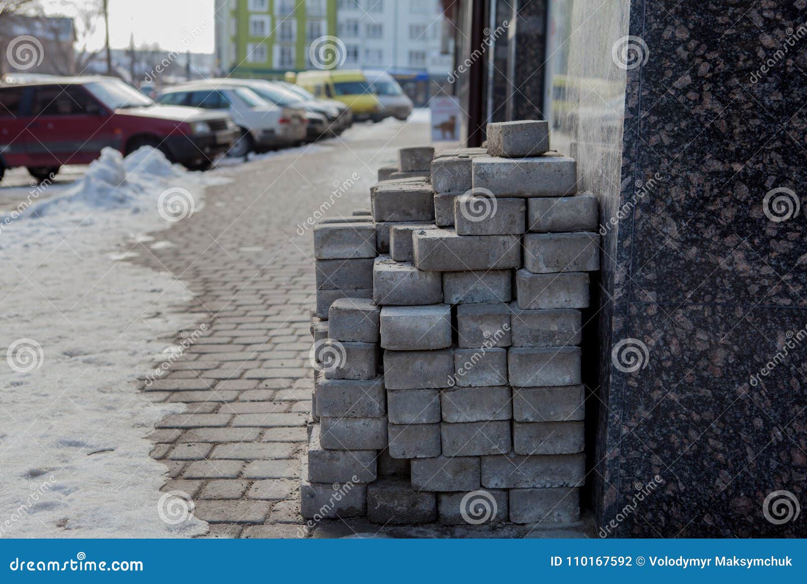 Piled Up Bricks on a Newly Paved Parking Area Stock Photo - Image of ...