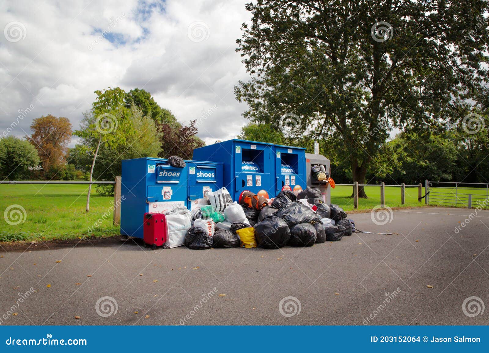 Piled up rubbish by bins editorial stock image. Image of junk - 203152064