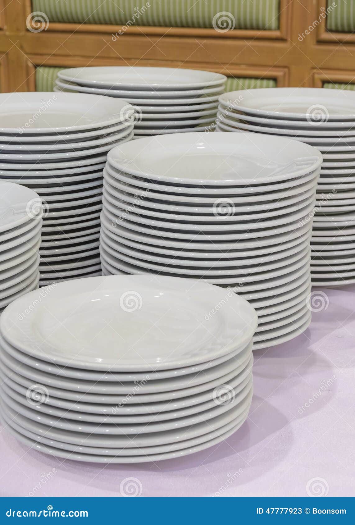 Piled Up of White Plates on Table Stock Image - Image of room, catering ...