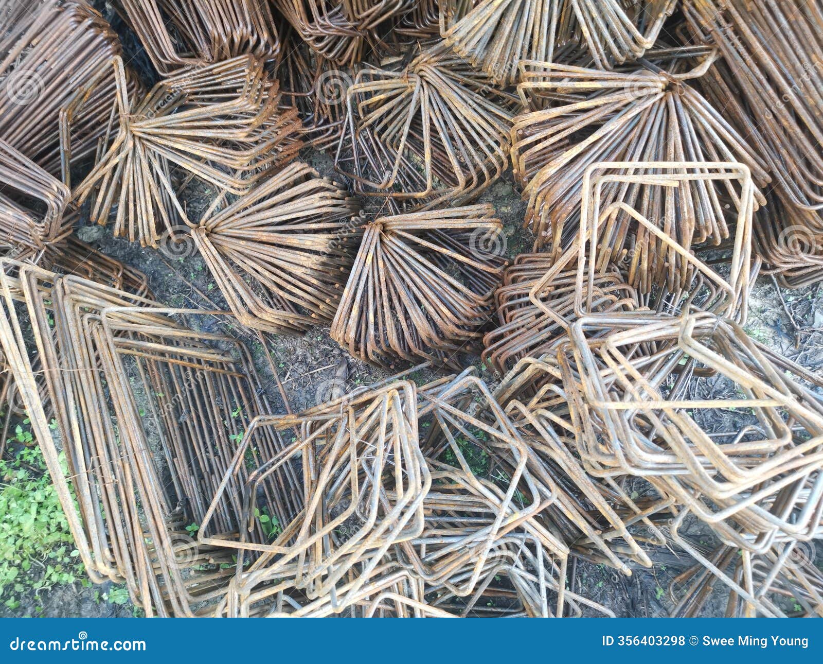 Piles of Bent Square-shaped Rusty Steel Grid Reinforcement Frame Lying ...