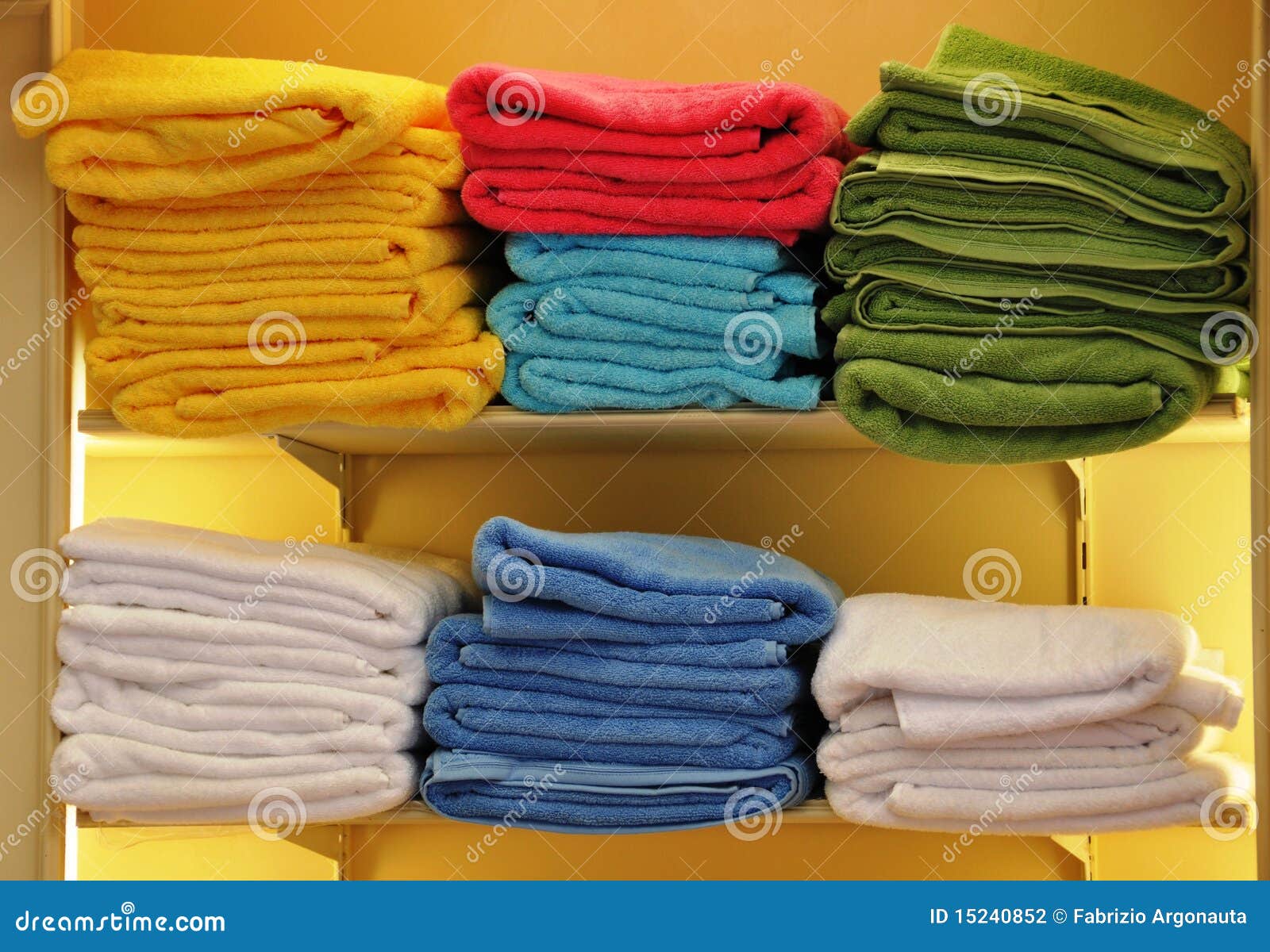 Piles of colorful towels stock photo. Image of display - 15240852