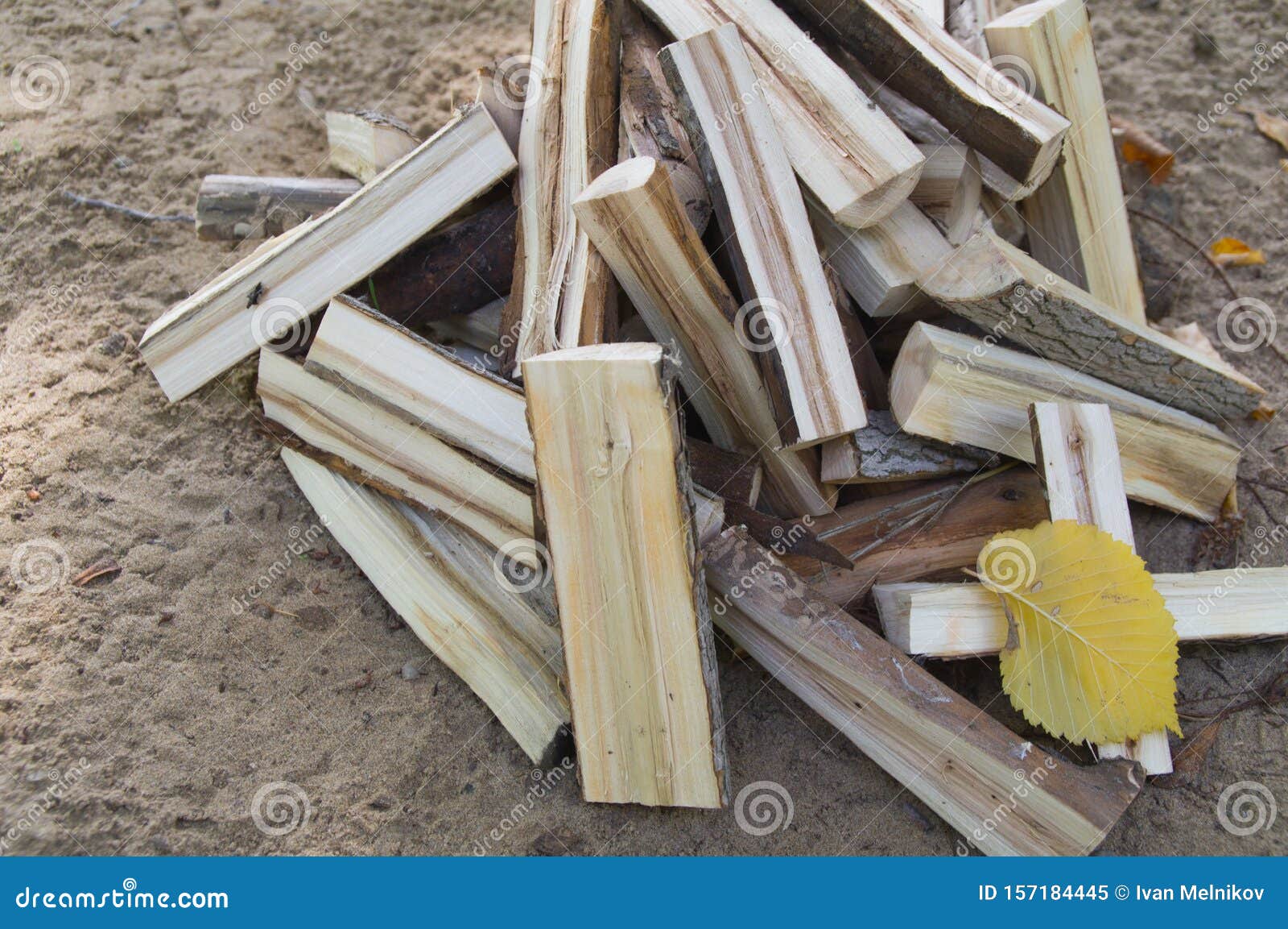 Piles of Cut Wood Laid Down on the Sand. Background Stock Image - Image ...