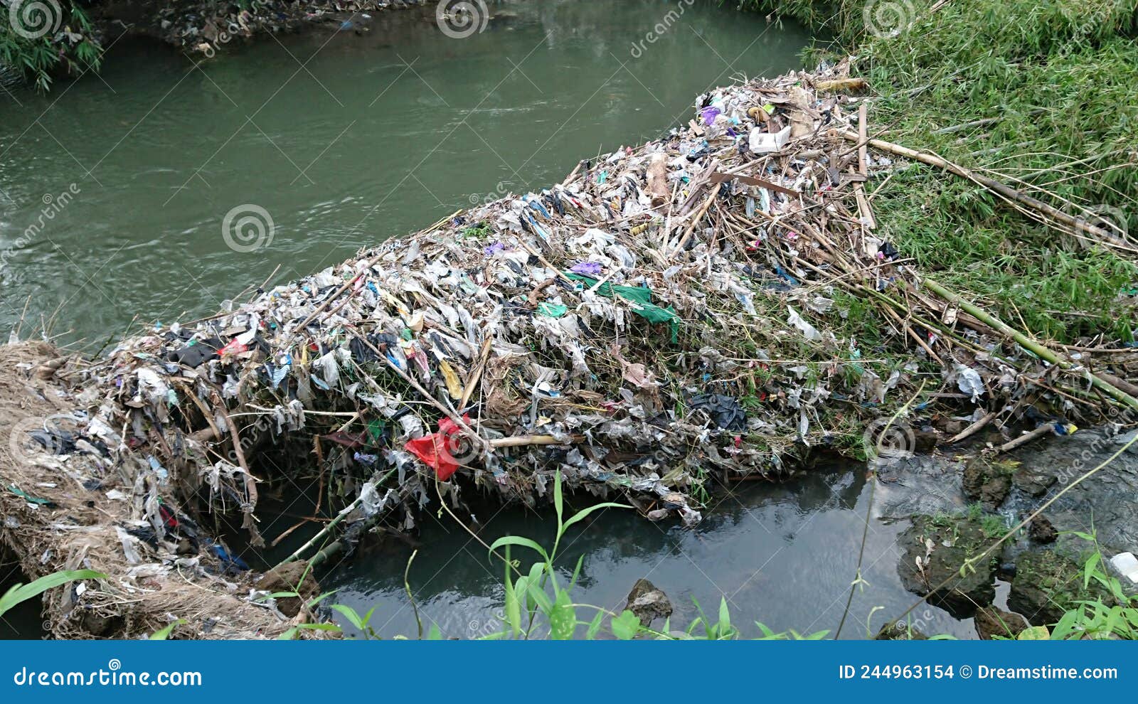 Piles of Garbage on the Banks of the River Due To Flooding Stock Photo ...