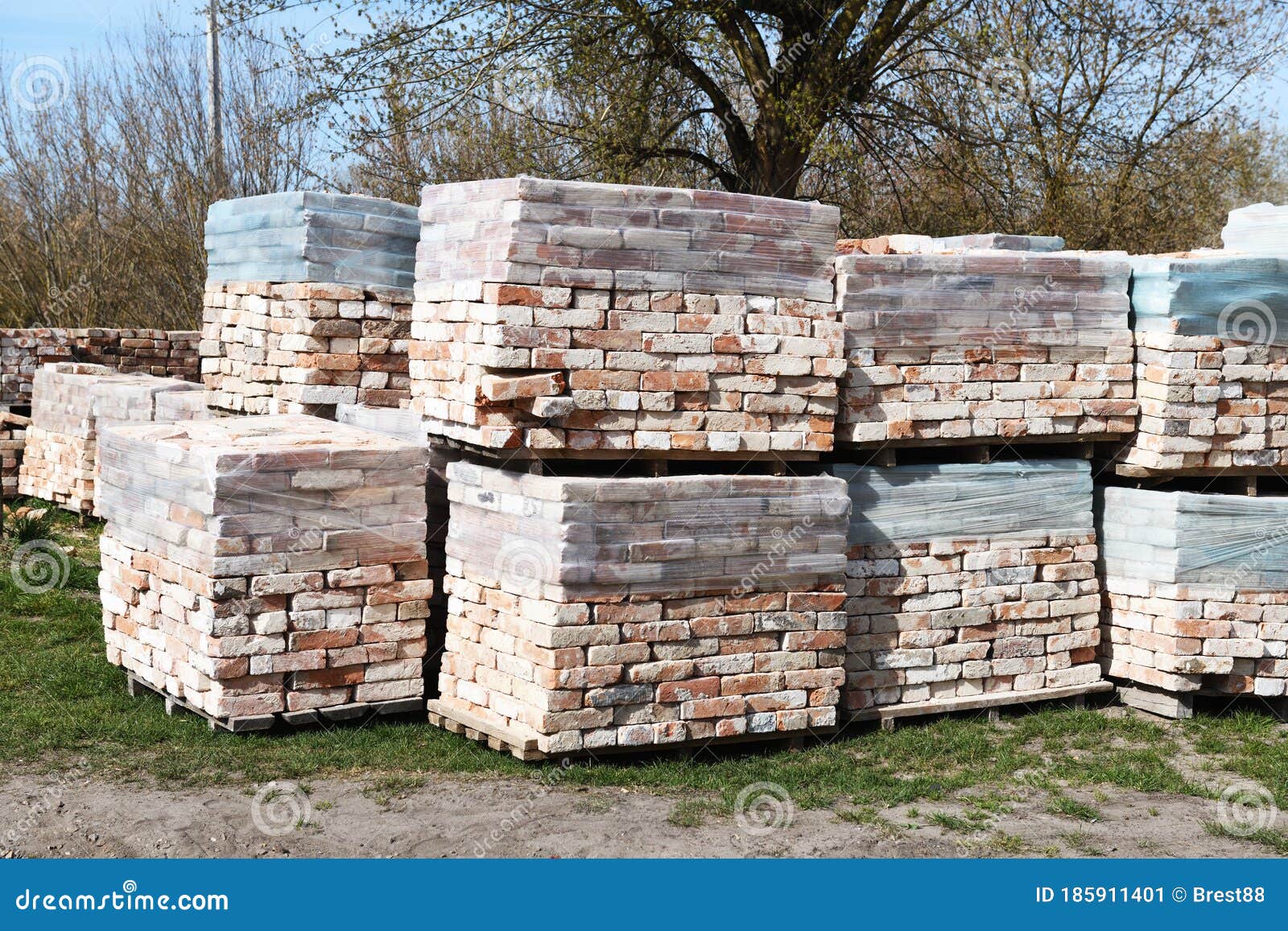 Piles of Restored Bricks on Pallets, Outdoors.Construction Materials ...