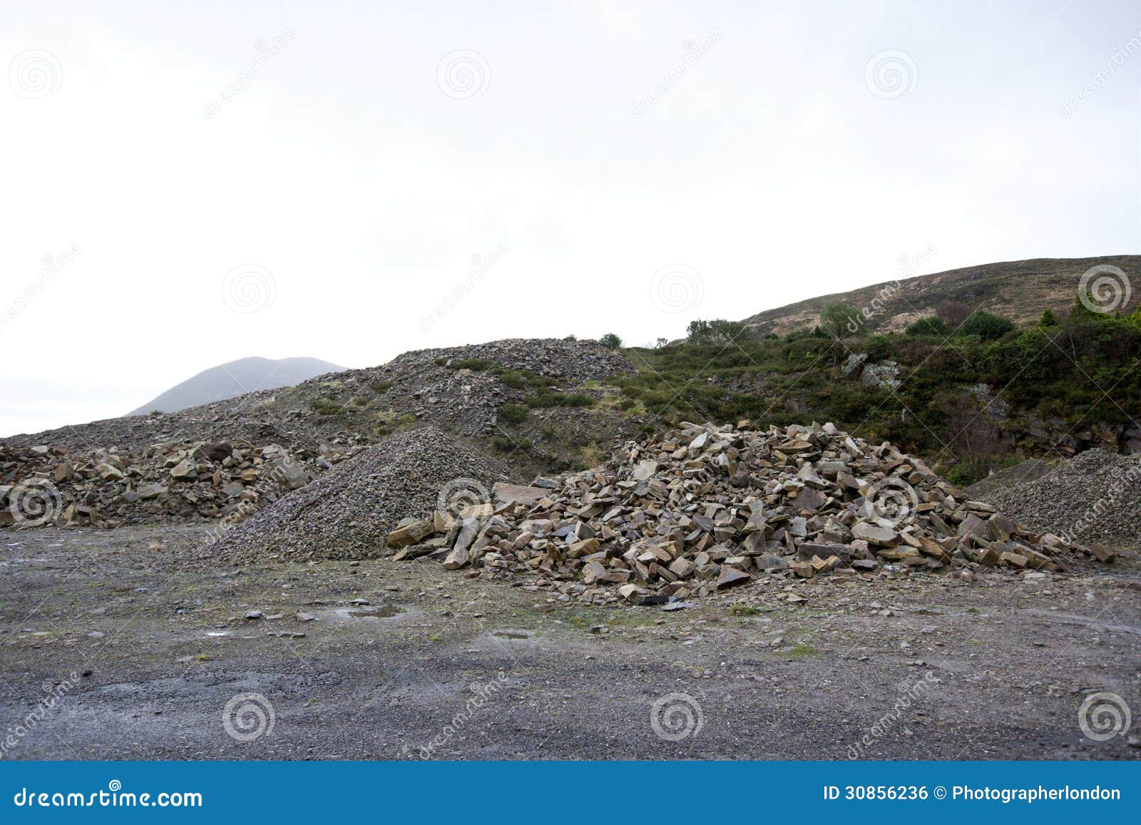 Piles of Rocks in Small Quarry Stock Photo - Image of outdoors, gravel ...