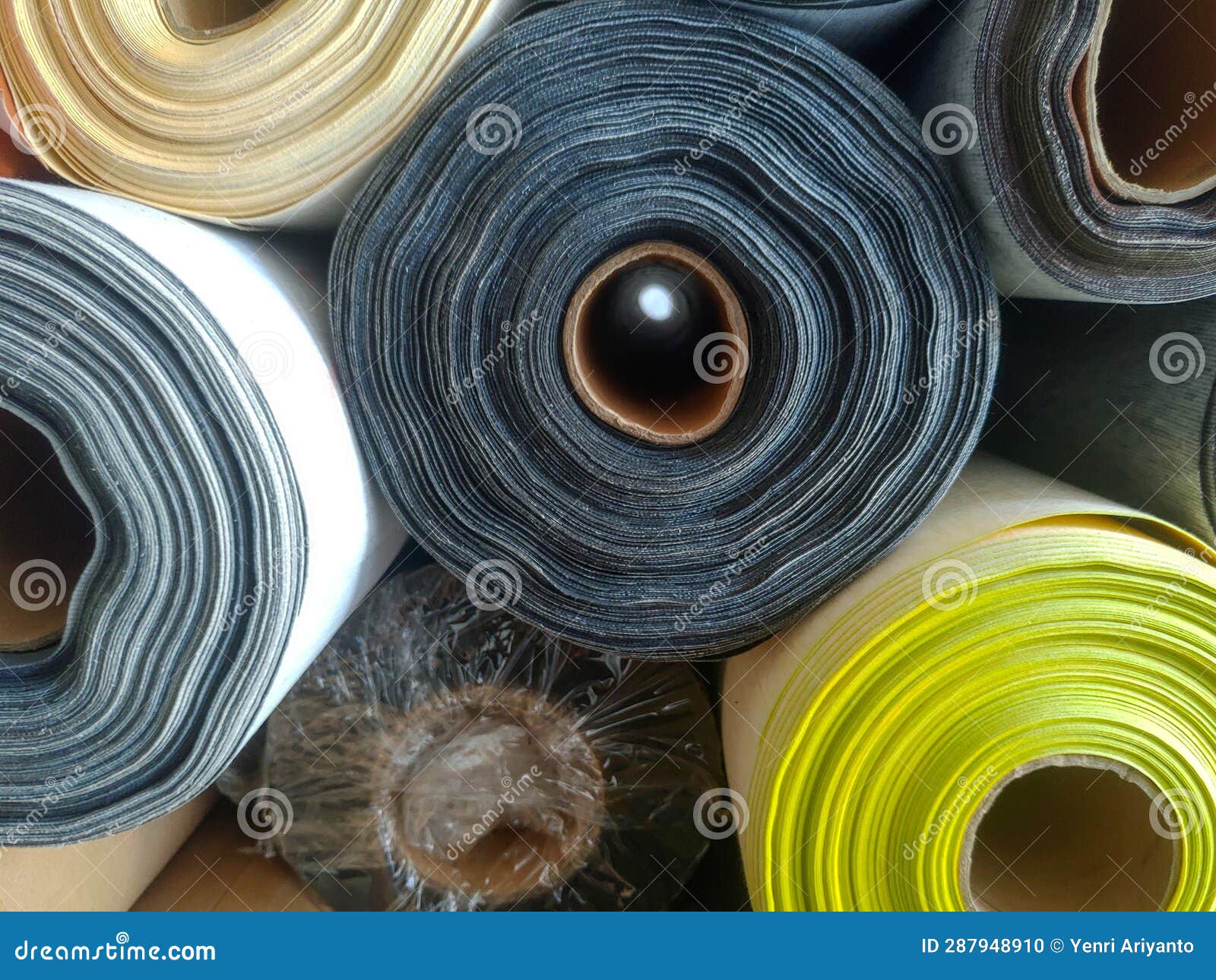 Piles of Rolls of Textile Fabrics of Various Colors Stock Photo - Image ...