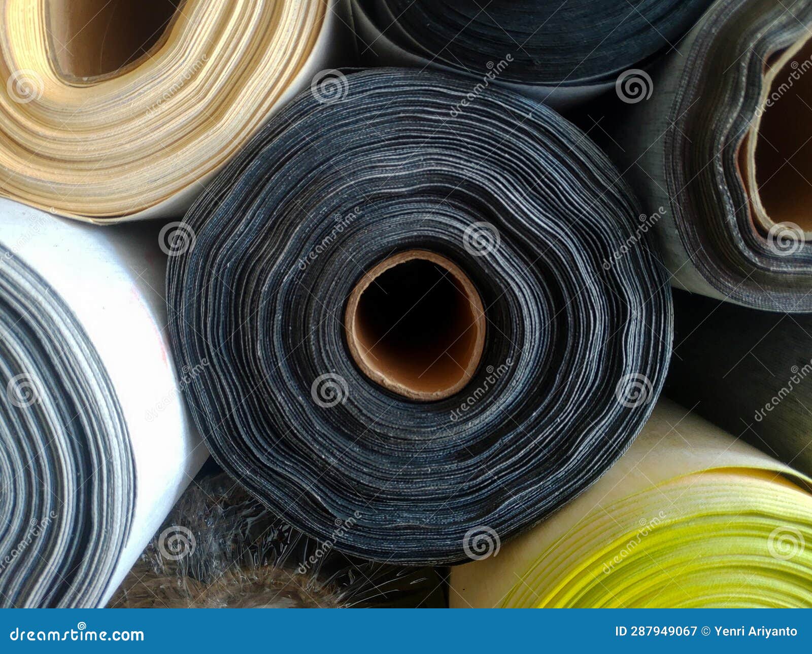 Piles of Rolls of Textile Fabrics of Various Colors Stock Image - Image ...