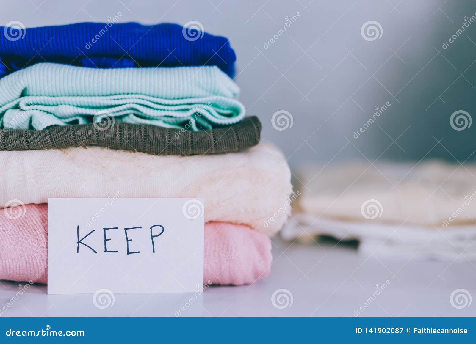 Piles of Tshirts and Clothes Being Sorted into Keep Discard and Donate ...