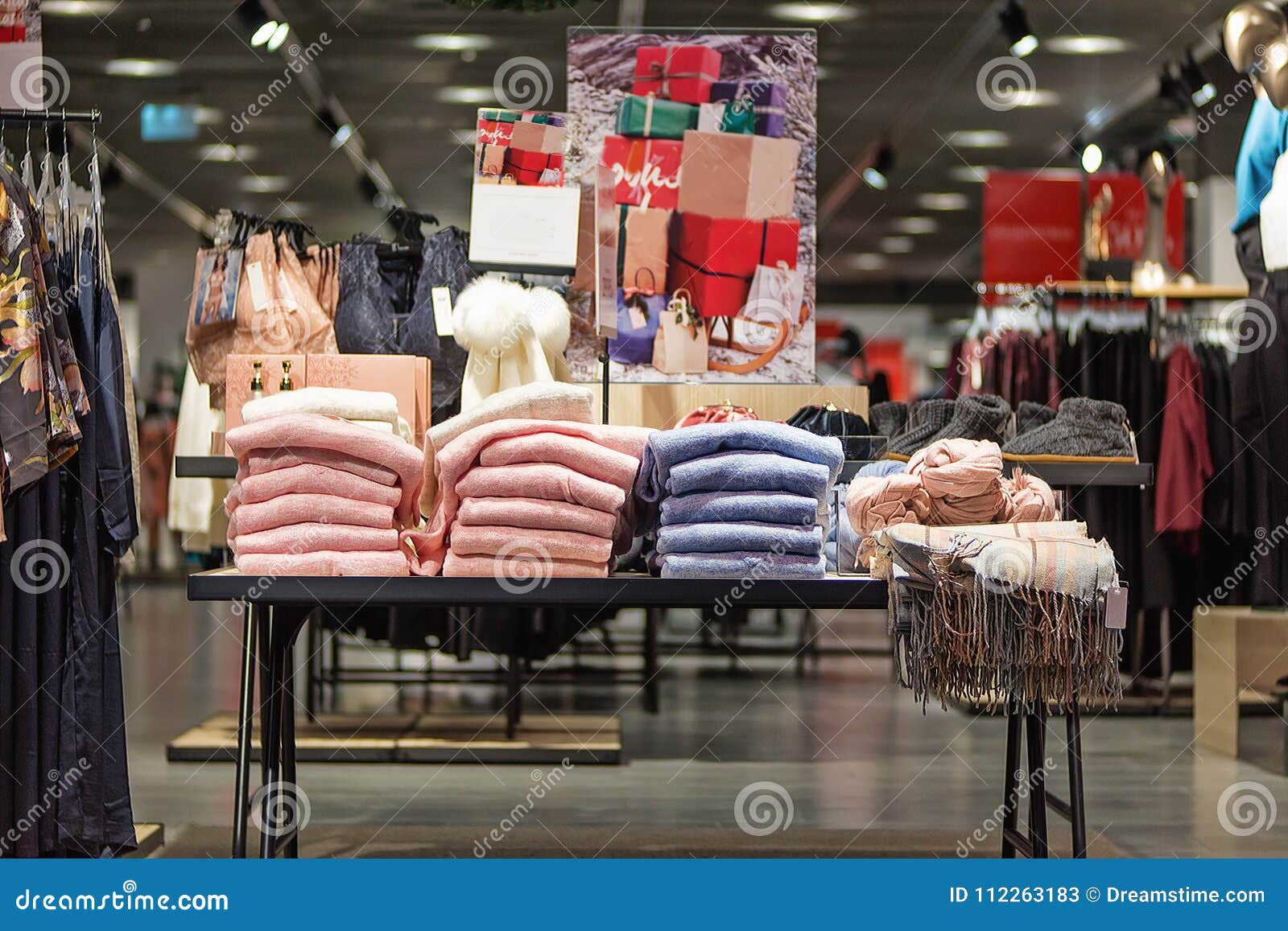 Piles of Various Folded Clothes Stock Image - Image of fashion, blurry ...