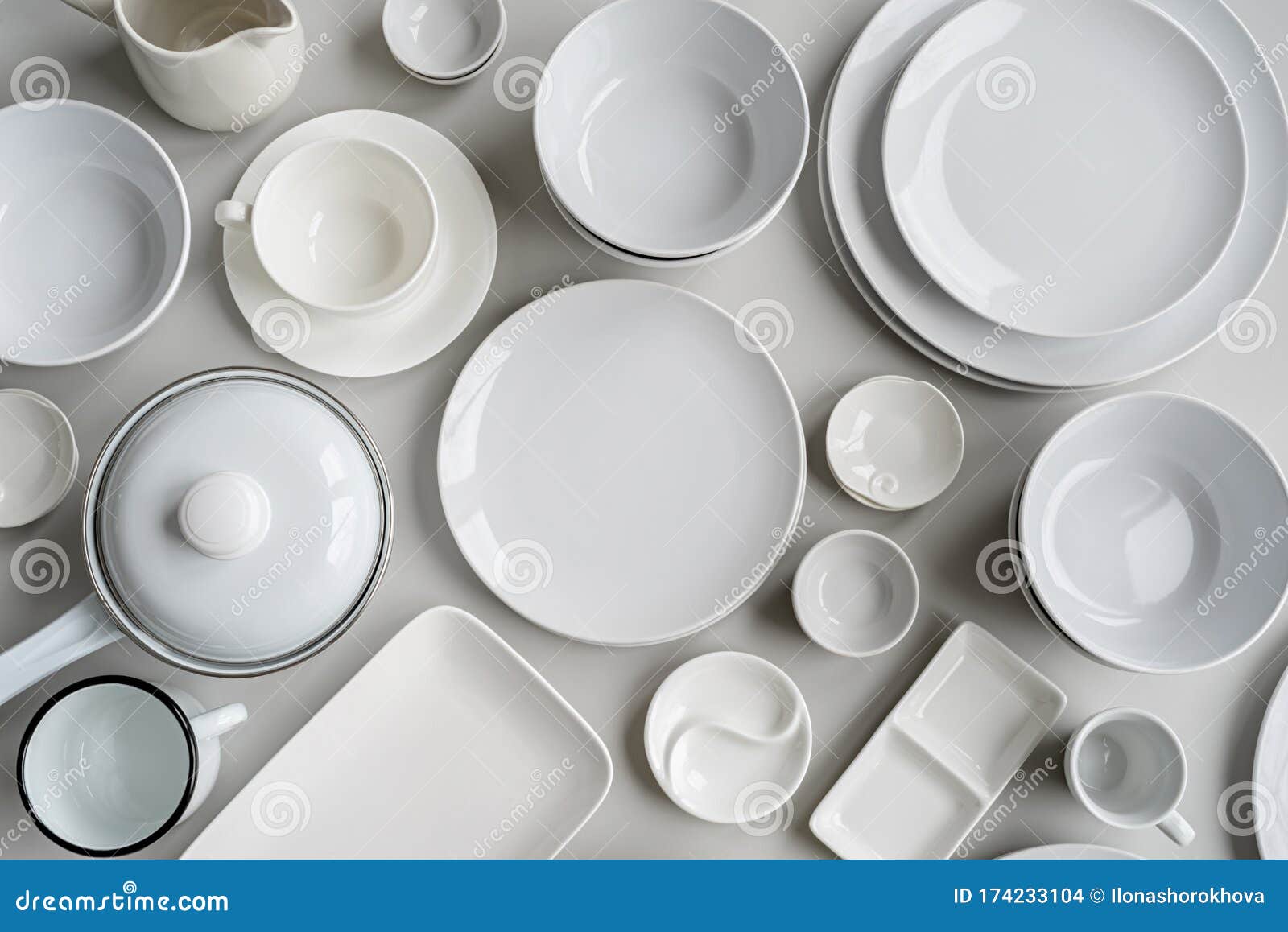 Piles of White Ceramic Dishes and Tableware Top View on Gray Background ...