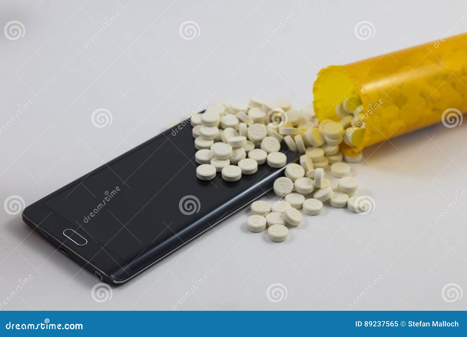 Pill Bottle and a Cell Phone Stock Image - Image of color, drugs: 89237565