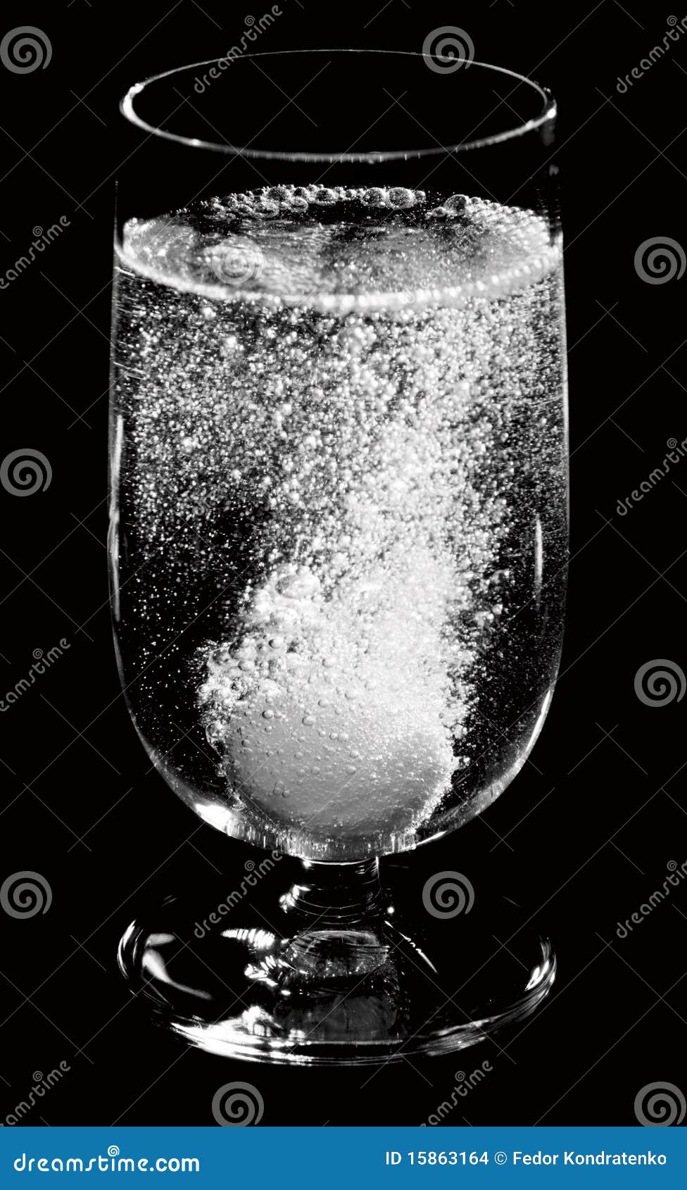 Pill dissolving in water stock photo. Image of splash - 15863164