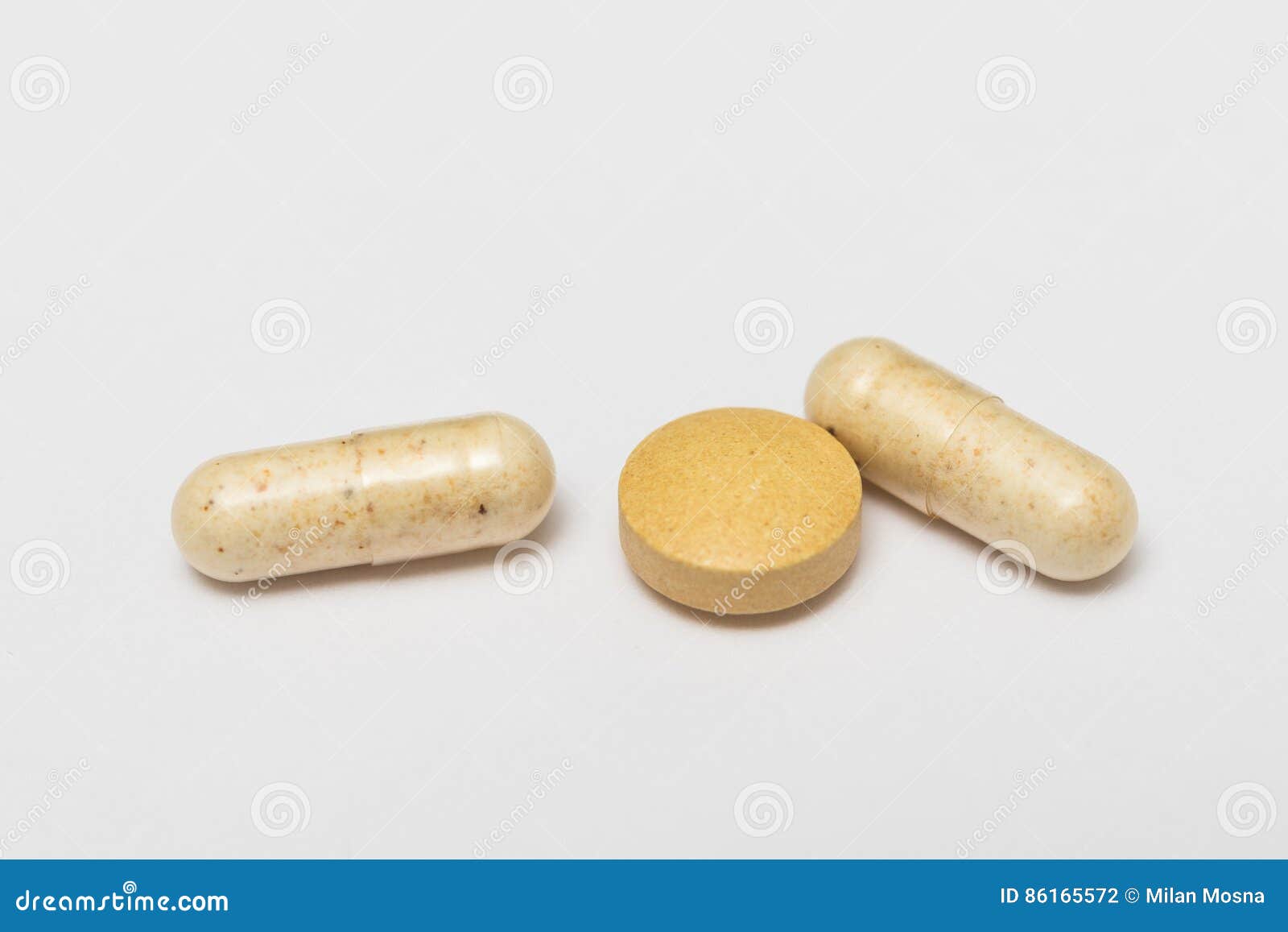 A Pill and Hard Capsules on White Background Stock Photo - Image of ...