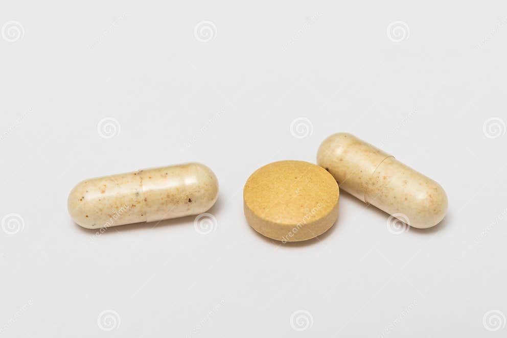 A Pill and Hard Capsules on White Background Stock Photo - Image of ...